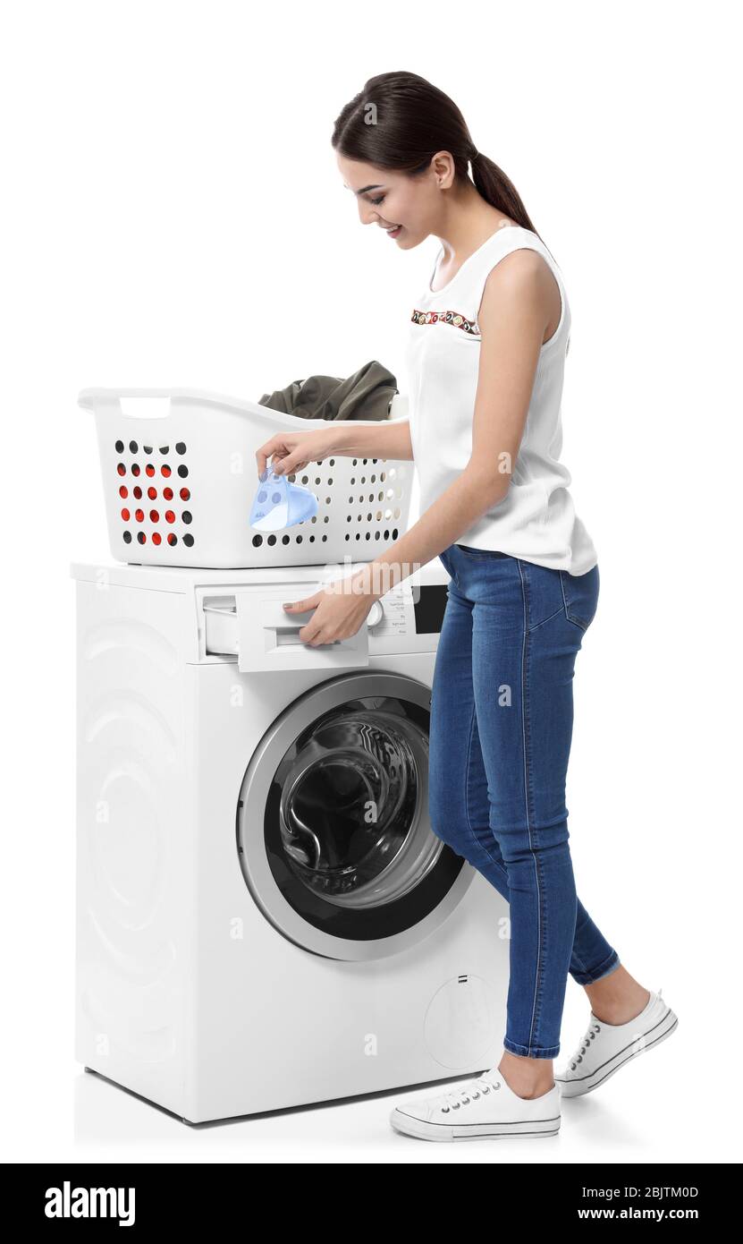 Young woman doing laundry on white background Stock Photo - Alamy