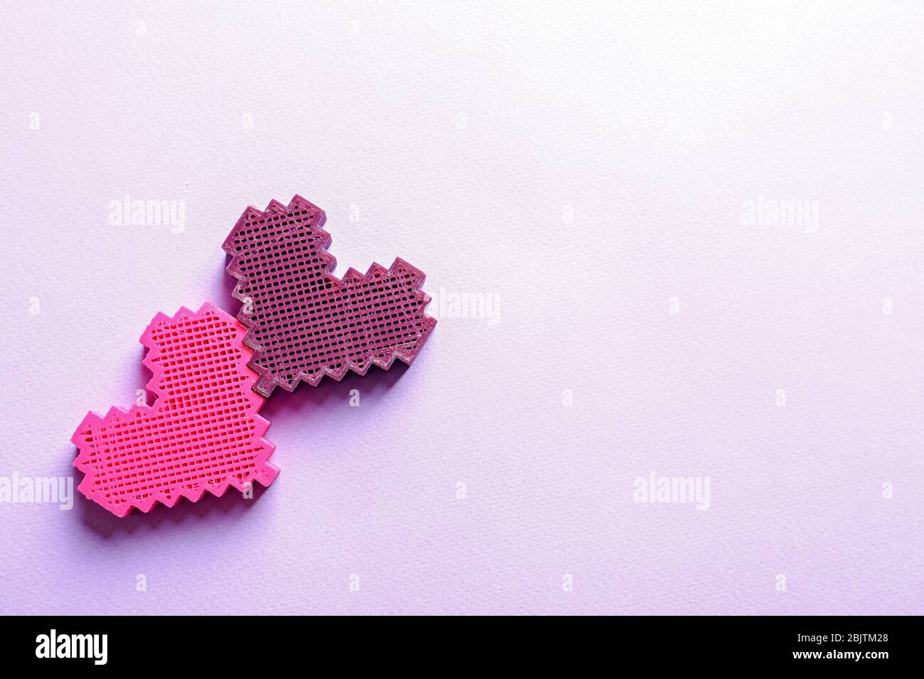 Two hearts on color background Stock Photo - Alamy