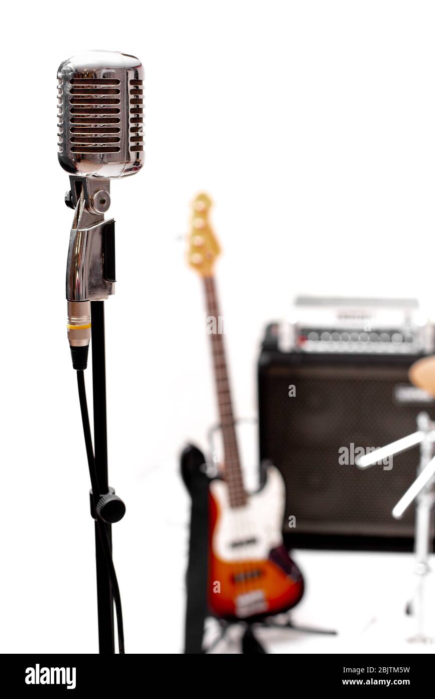 Microphone and music instrument. Microphone in a recording studio with ...