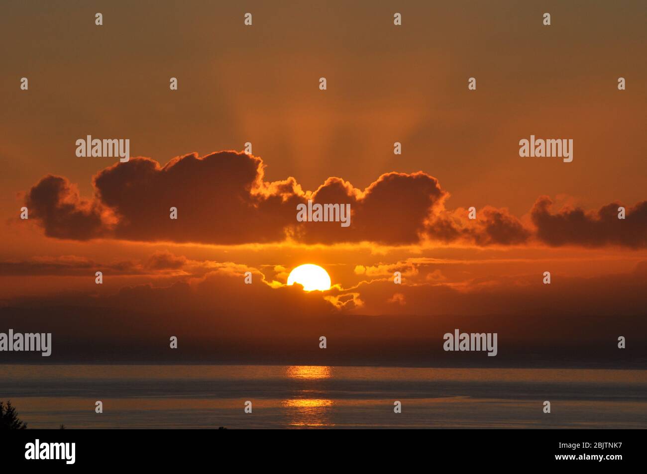Sunset over the Isle of Arran from Culzean on the Scottish mainland ...
