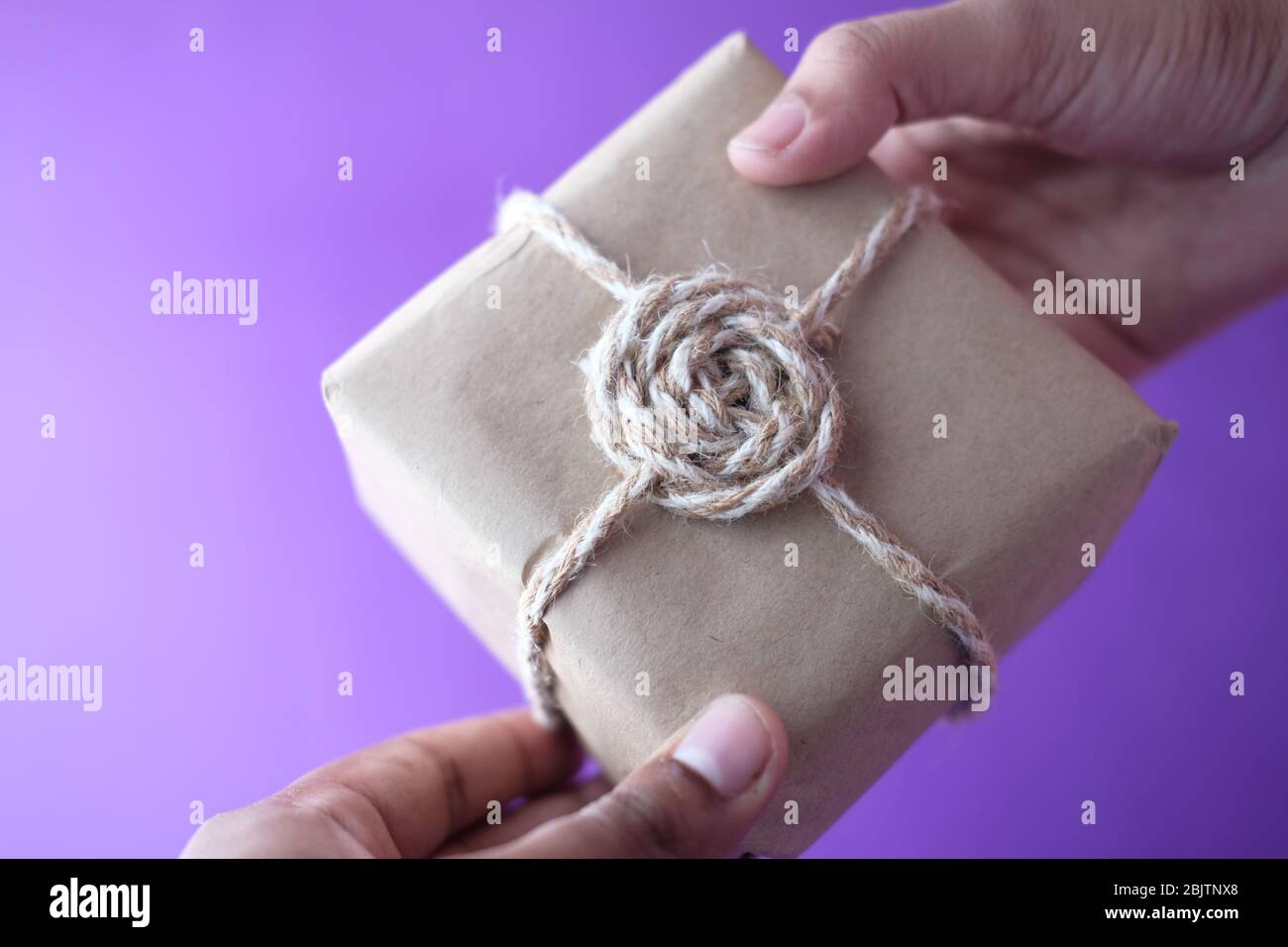 hand holding crafted paper gift boxes Stock Photo - Alamy
