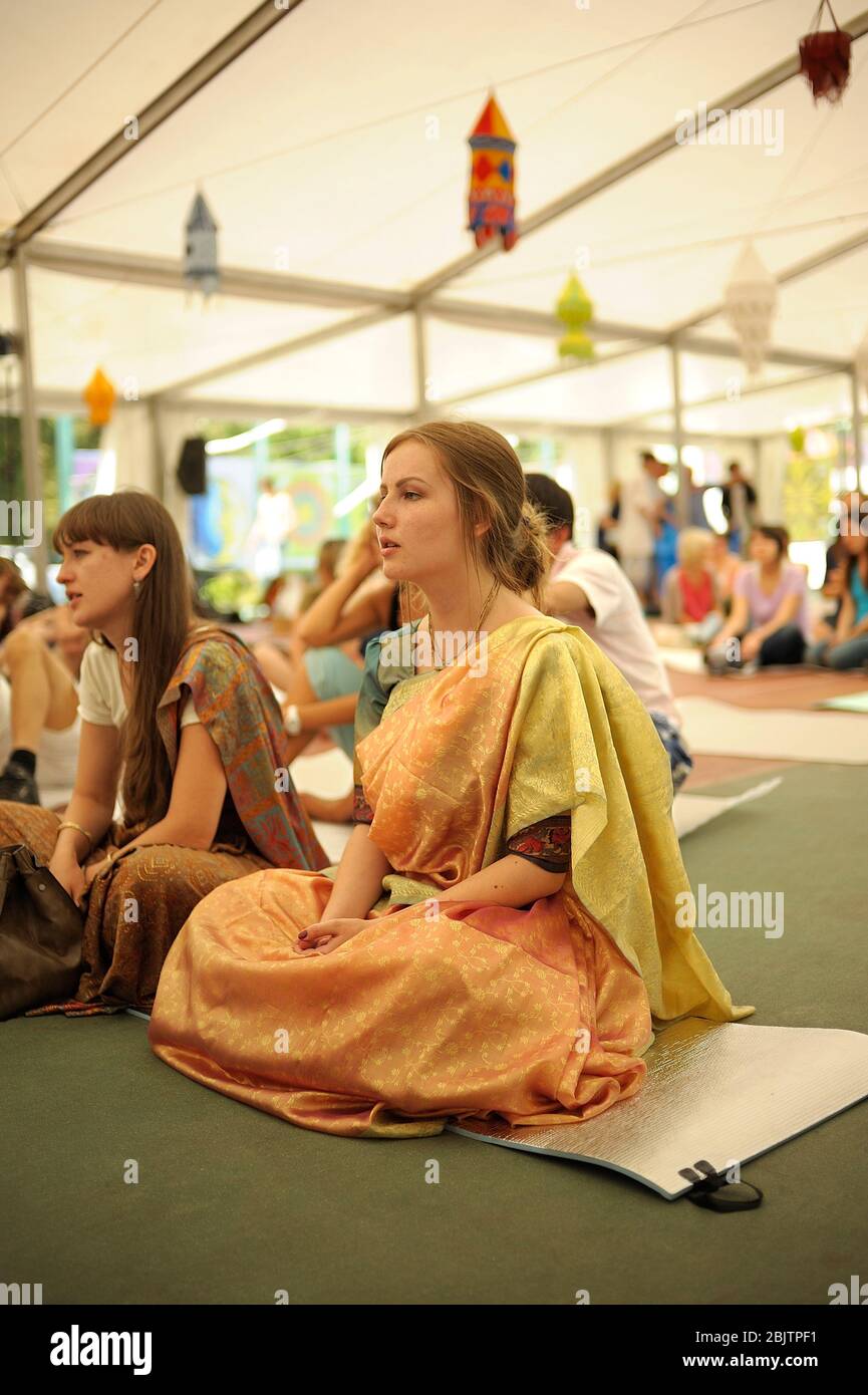 People sitting on the floor and listening to guru preaching during ...