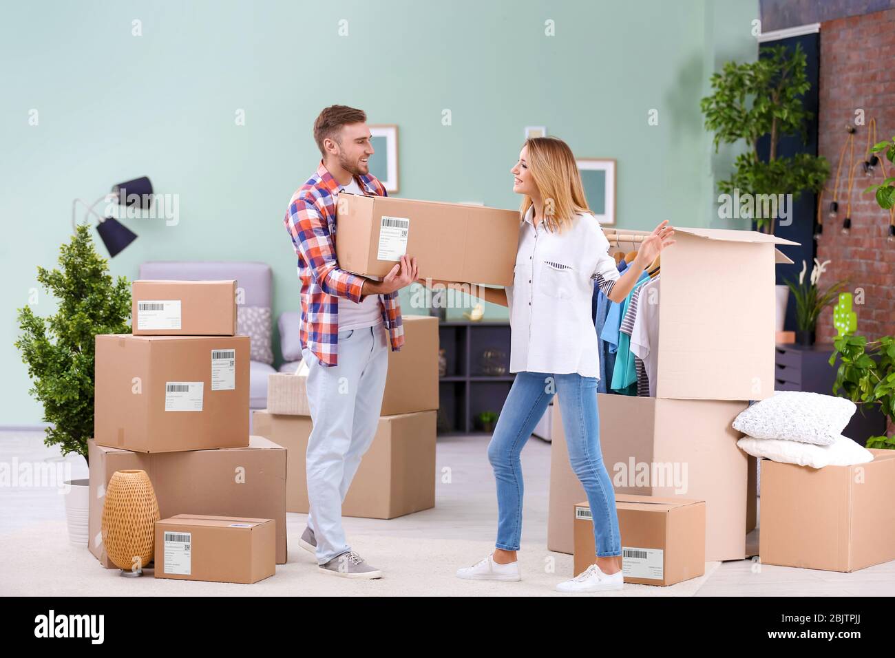 Young couple wardrobe boxes hi-res stock photography and images - Alamy