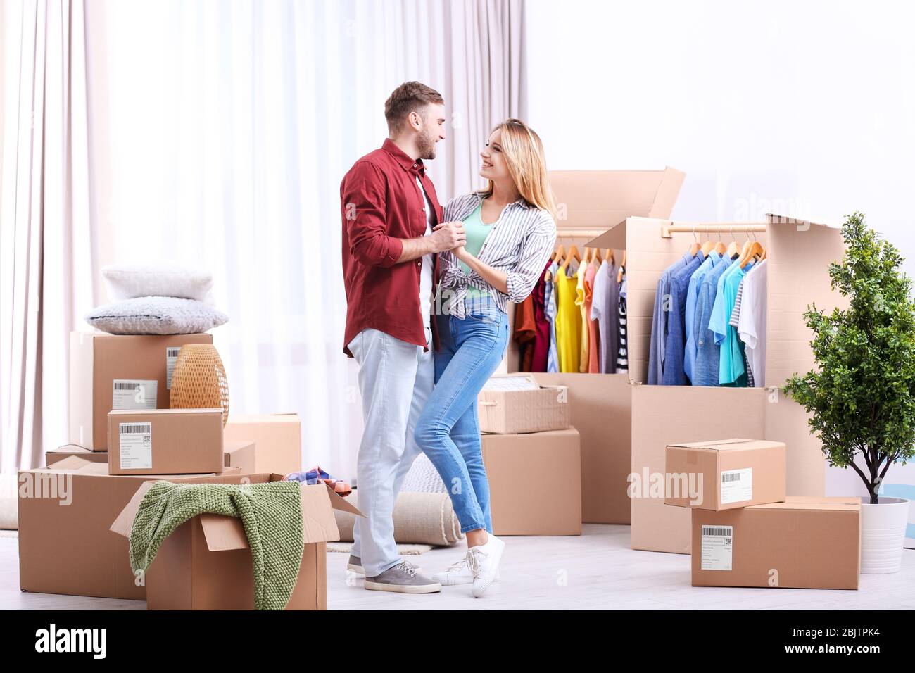 Young couple wardrobe boxes hi-res stock photography and images - Alamy