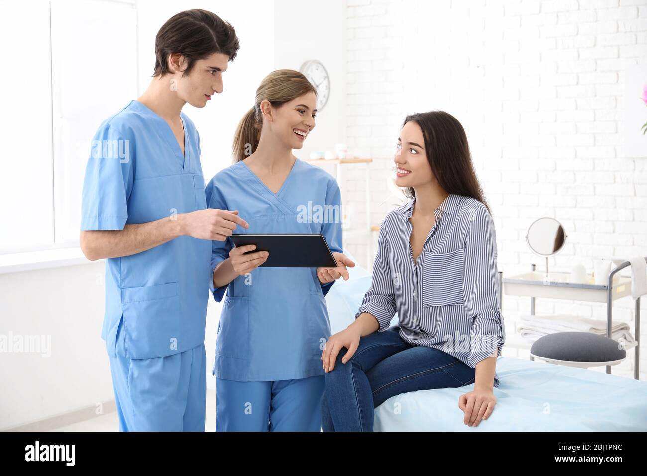 Professional beautician teaching trainee in salon. Apprenticeship ...