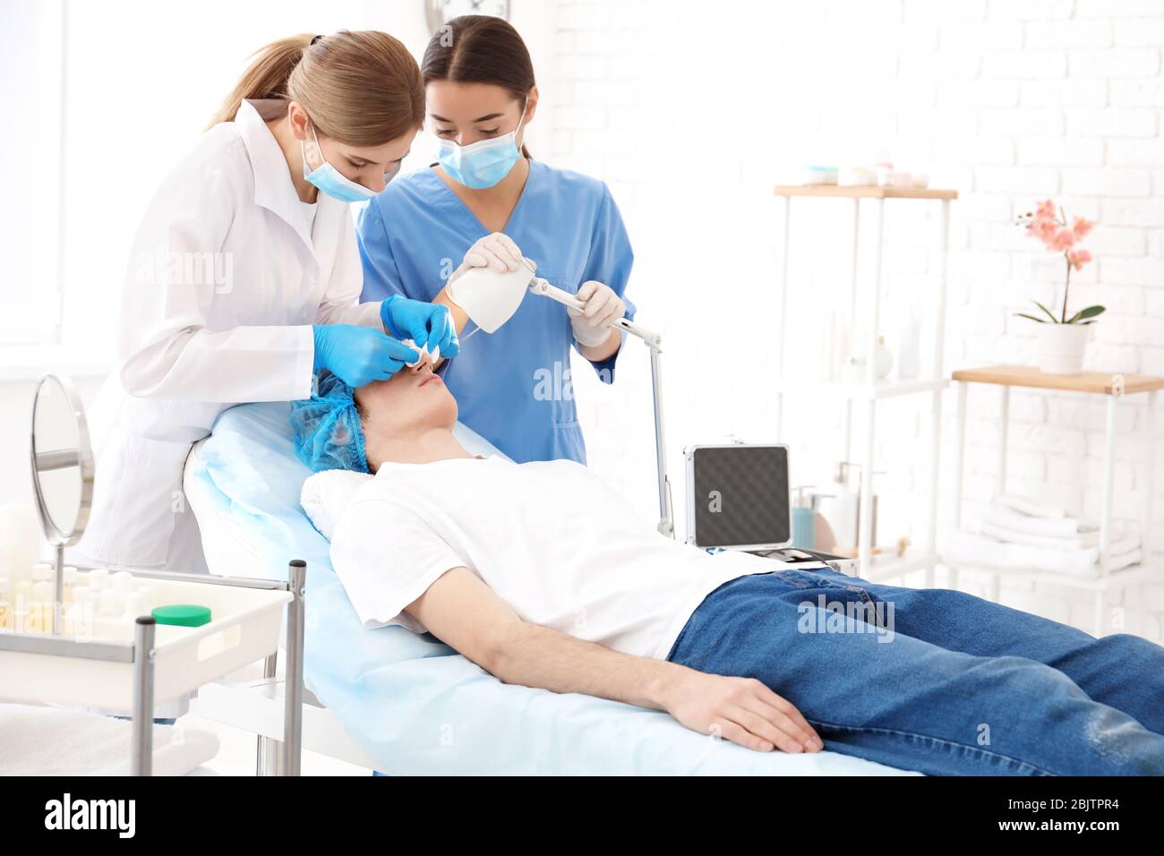 Professional beautician teaching trainee in salon. Apprenticeship ...