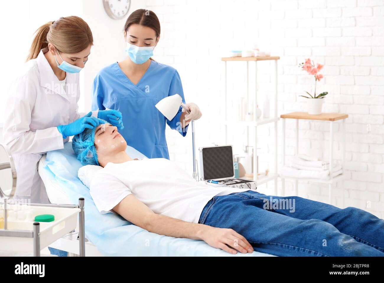 Professional beautician teaching trainee in salon. Apprenticeship ...