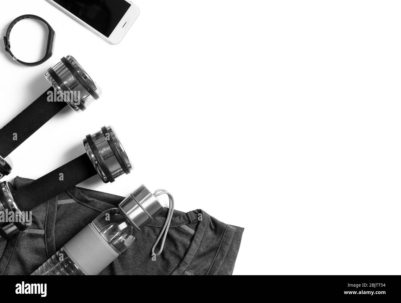 Gym stuff, mobile phone and blank space for exercise plan on white ...