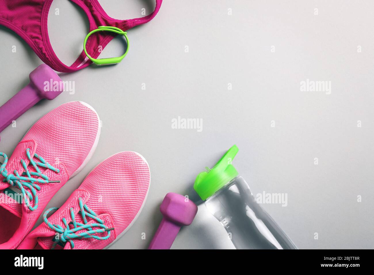 Gym stuff and blank space for exercise plan on light background. Flat ...