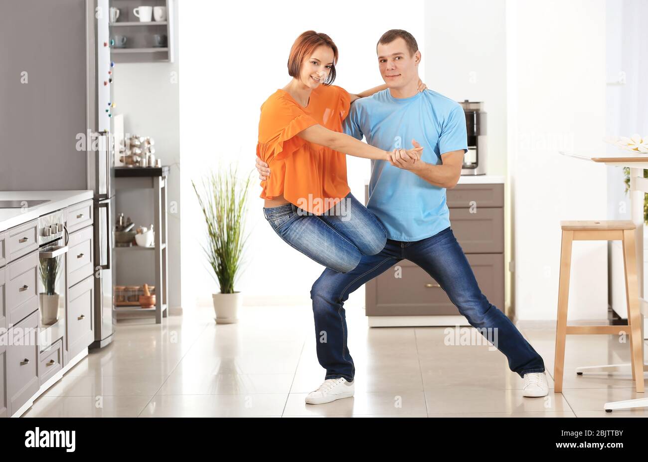 Cute loving couple dancing at home Stock Photo - Alamy