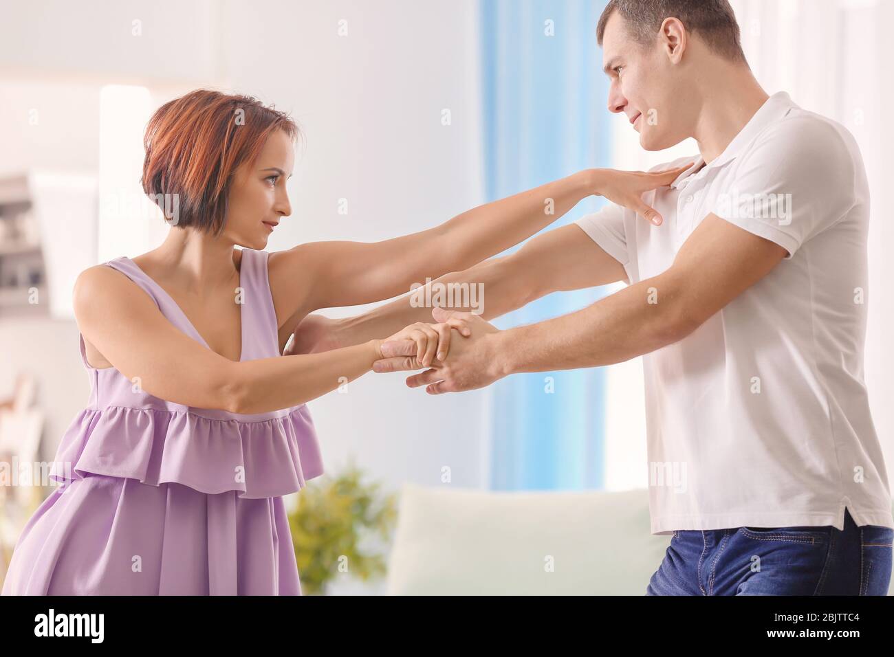 Cute loving couple dancing at home Stock Photo - Alamy