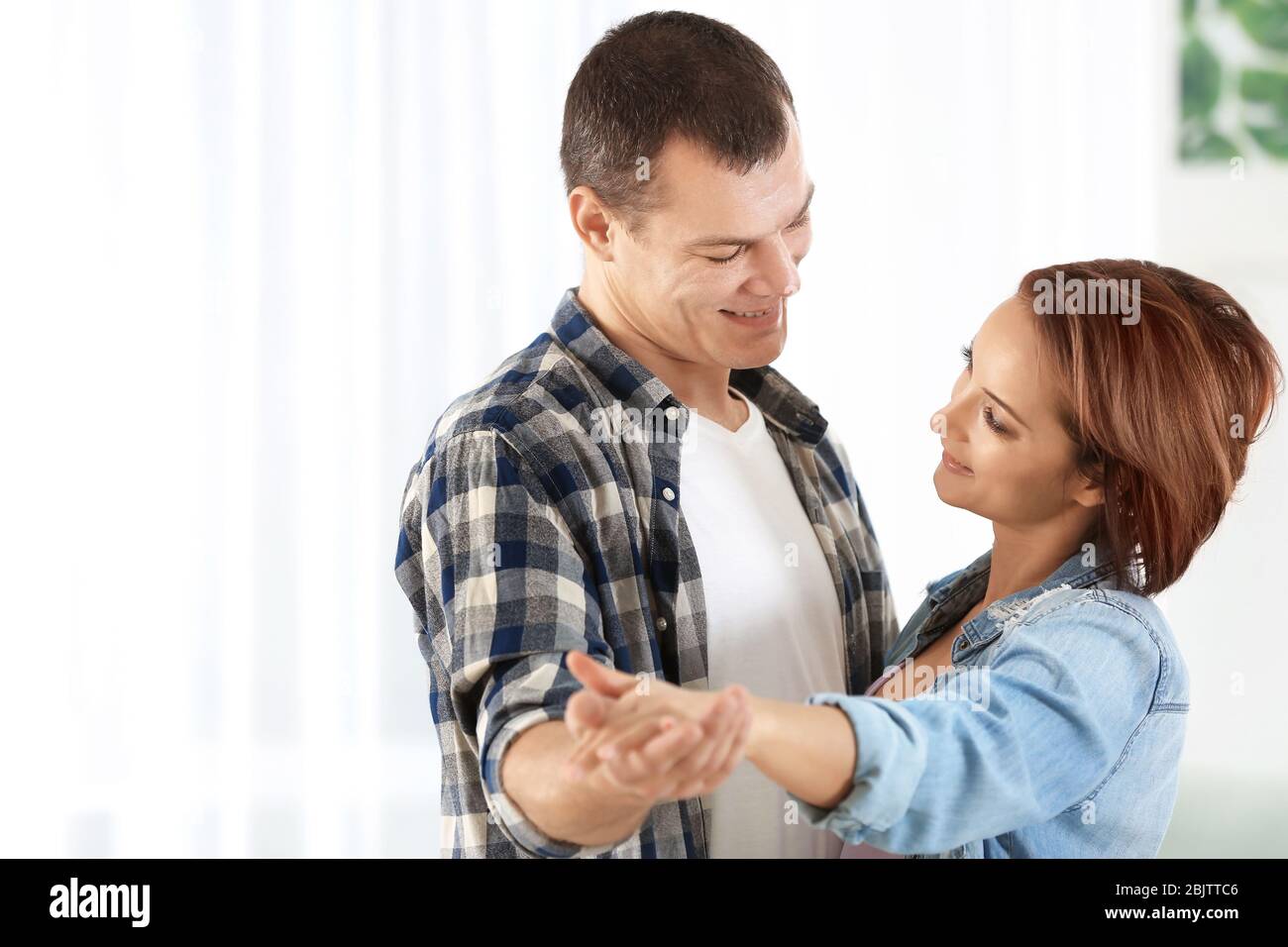 Cute loving couple dancing at home Stock Photo - Alamy