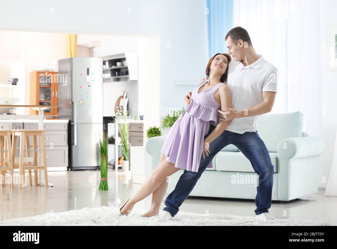 Cute loving couple dancing at home Stock Photo - Alamy