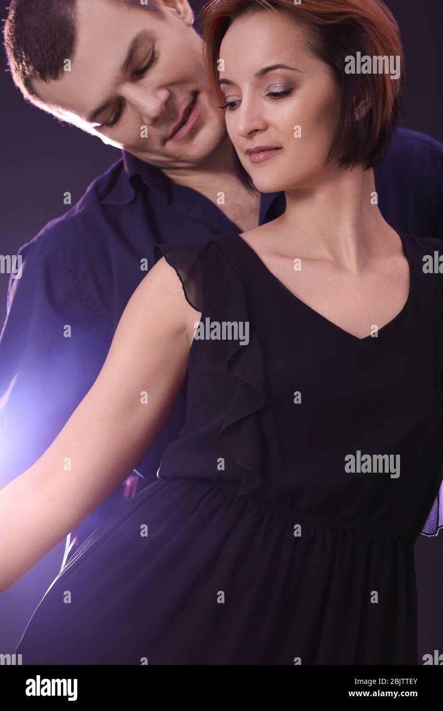 Portrait of loving couple in night club Stock Photo - Alamy