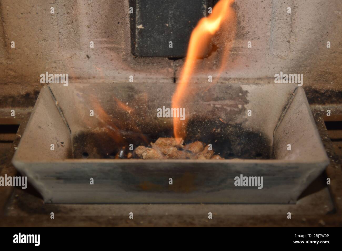 Wood pellets in the fire Stock Photo - Alamy