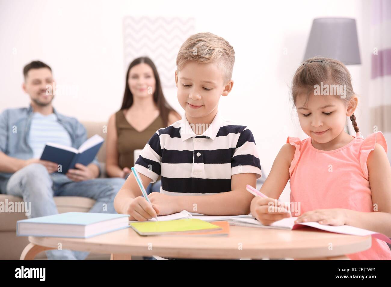 Brother and sister doing their homework Stock Photo - Alamy