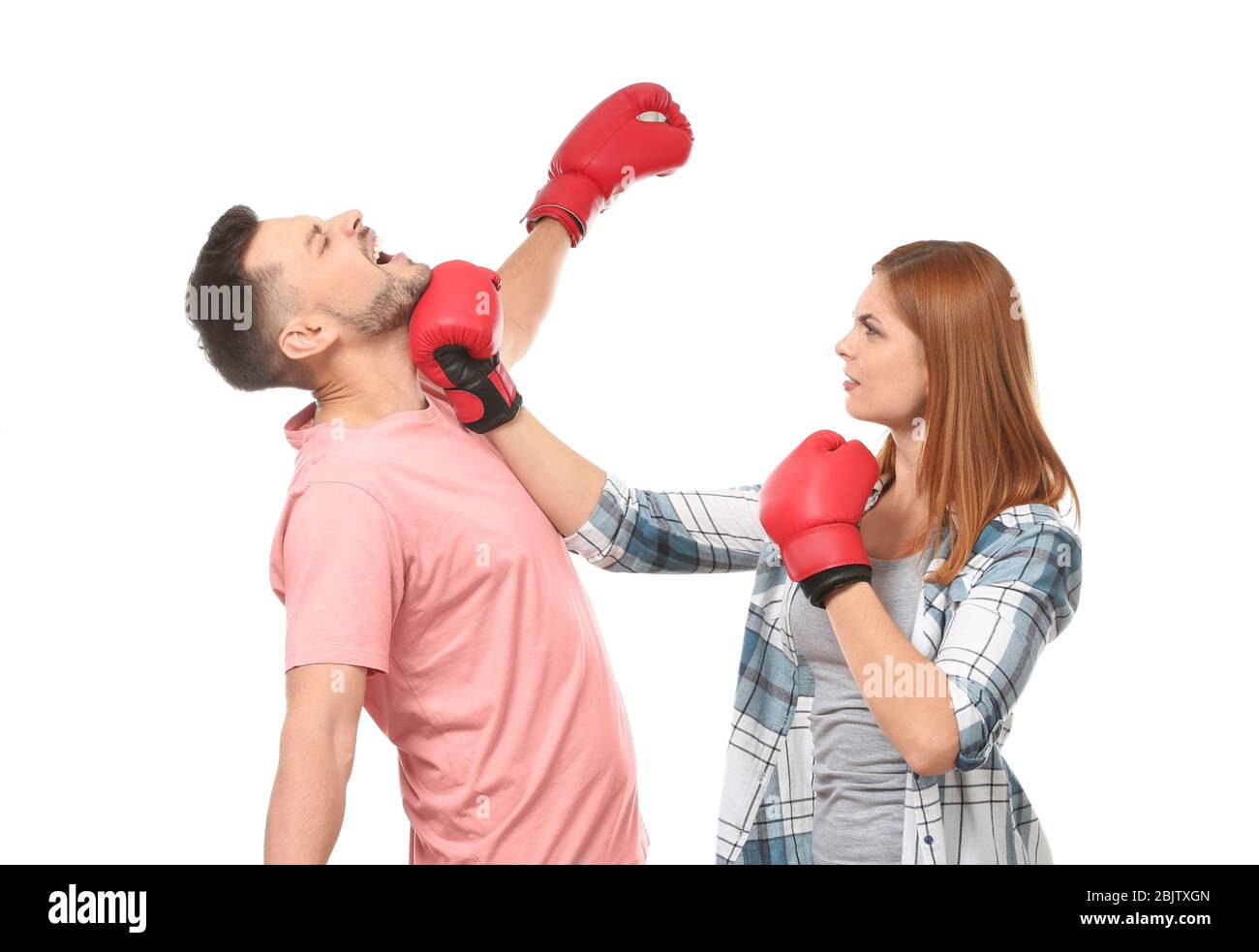 Angry couple in boxing gloves fighting on white background Stock Photo ...