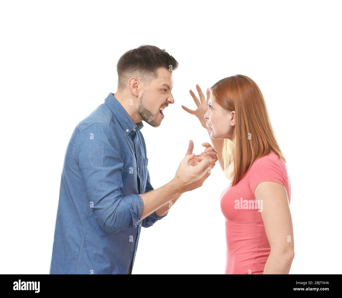 Emotional couple during quarrel on white background Stock Photo - Alamy