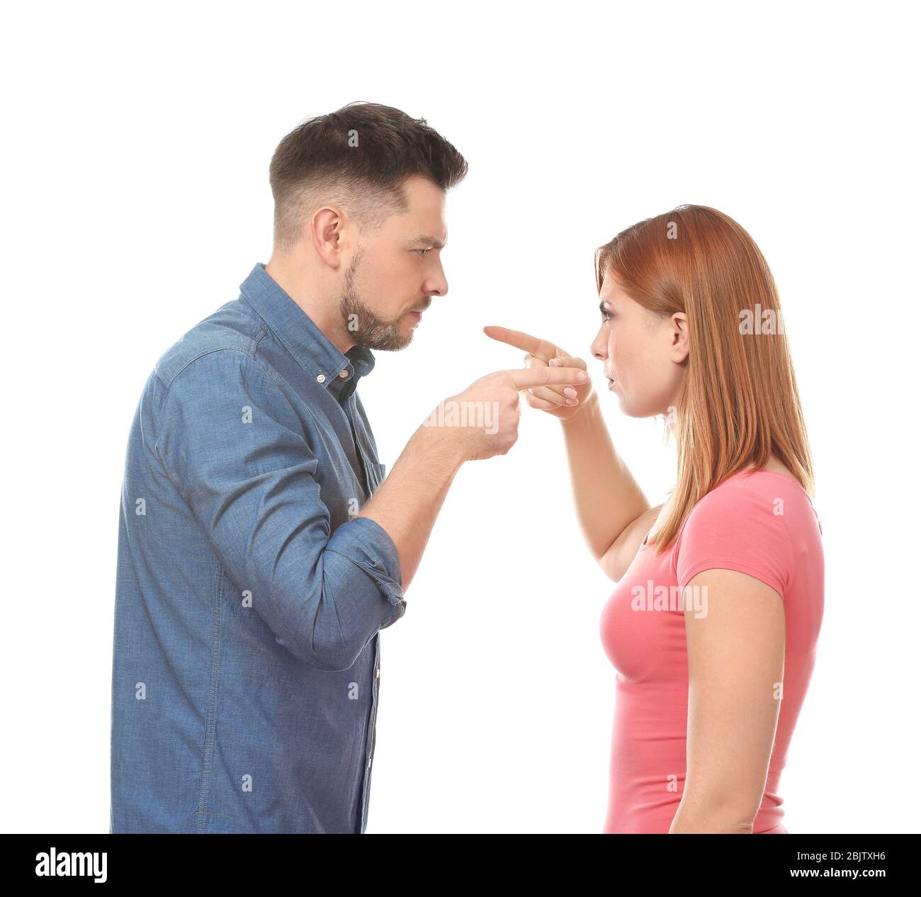 Displeased couple during quarrel on white background Stock Photo - Alamy