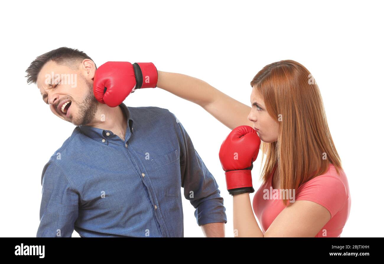 Angry couple in boxing gloves fighting on white background Stock Photo ...