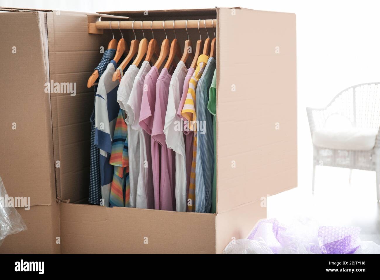Wardrobe box with clothes indoors, closeup Stock Photo - Alamy