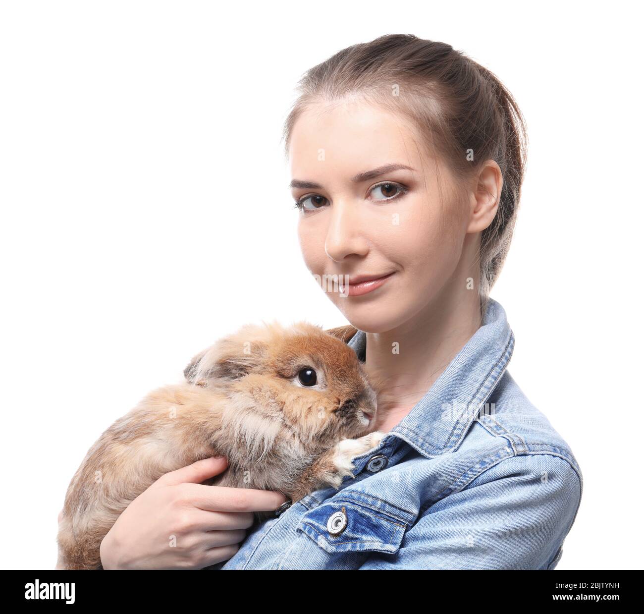 Beautiful young woman with pet rabbit on white background Stock Photo ...