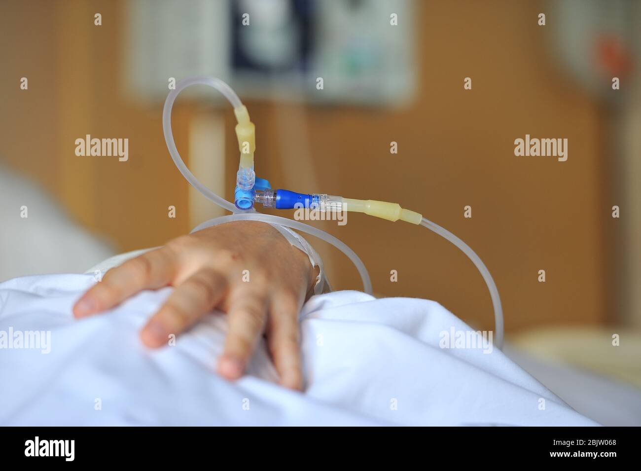 hand in hospital with dropper Stock Photo - Alamy