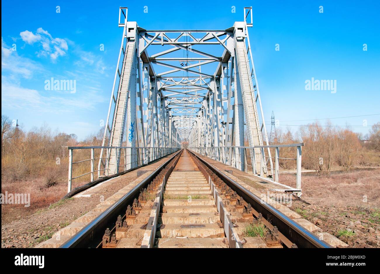 railroad bridge of steel, inside view passes over the river, around the ...