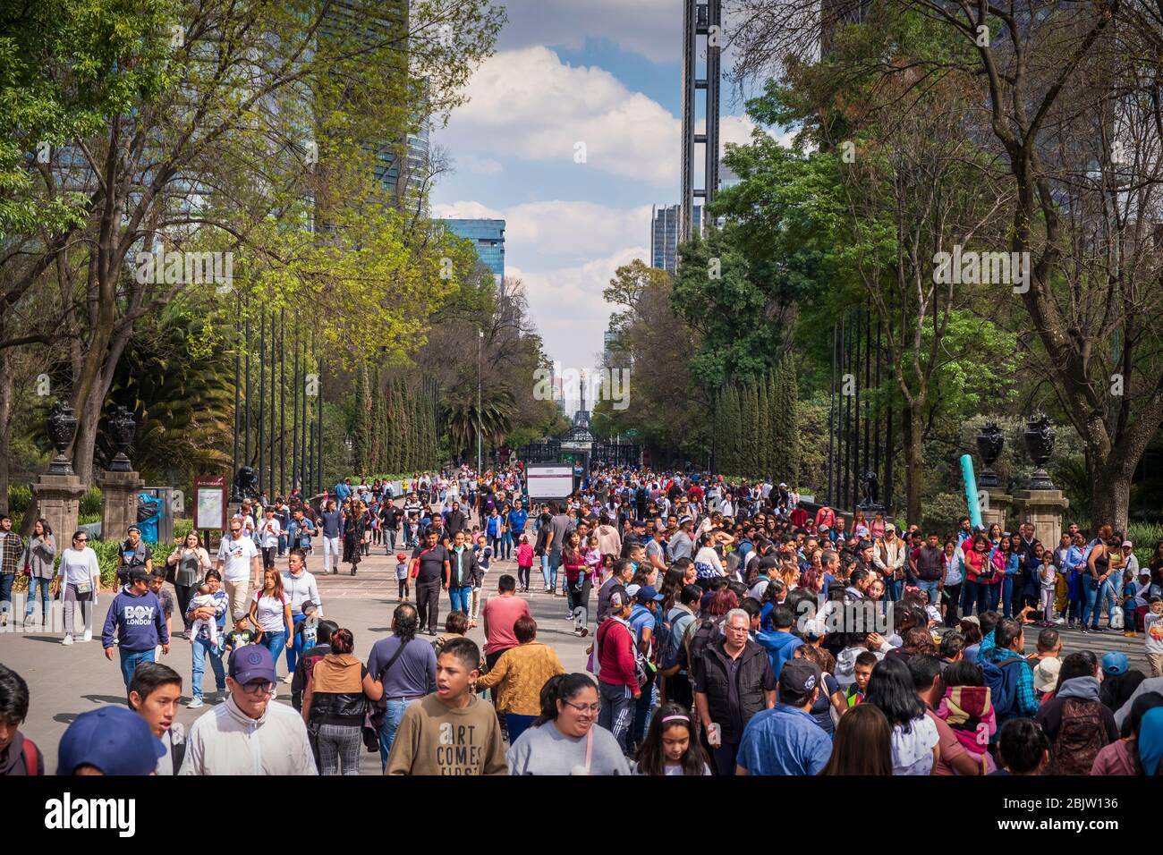 Crowds on Chapultepec Avenue looking towards city near Chapultepec Park ...
