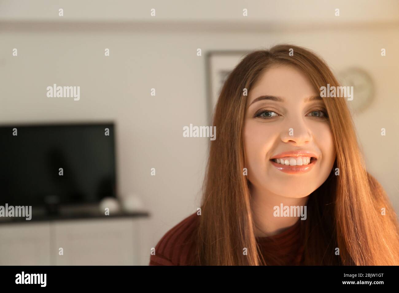 Portrait of beautiful smiling woman at home Stock Photo - Alamy