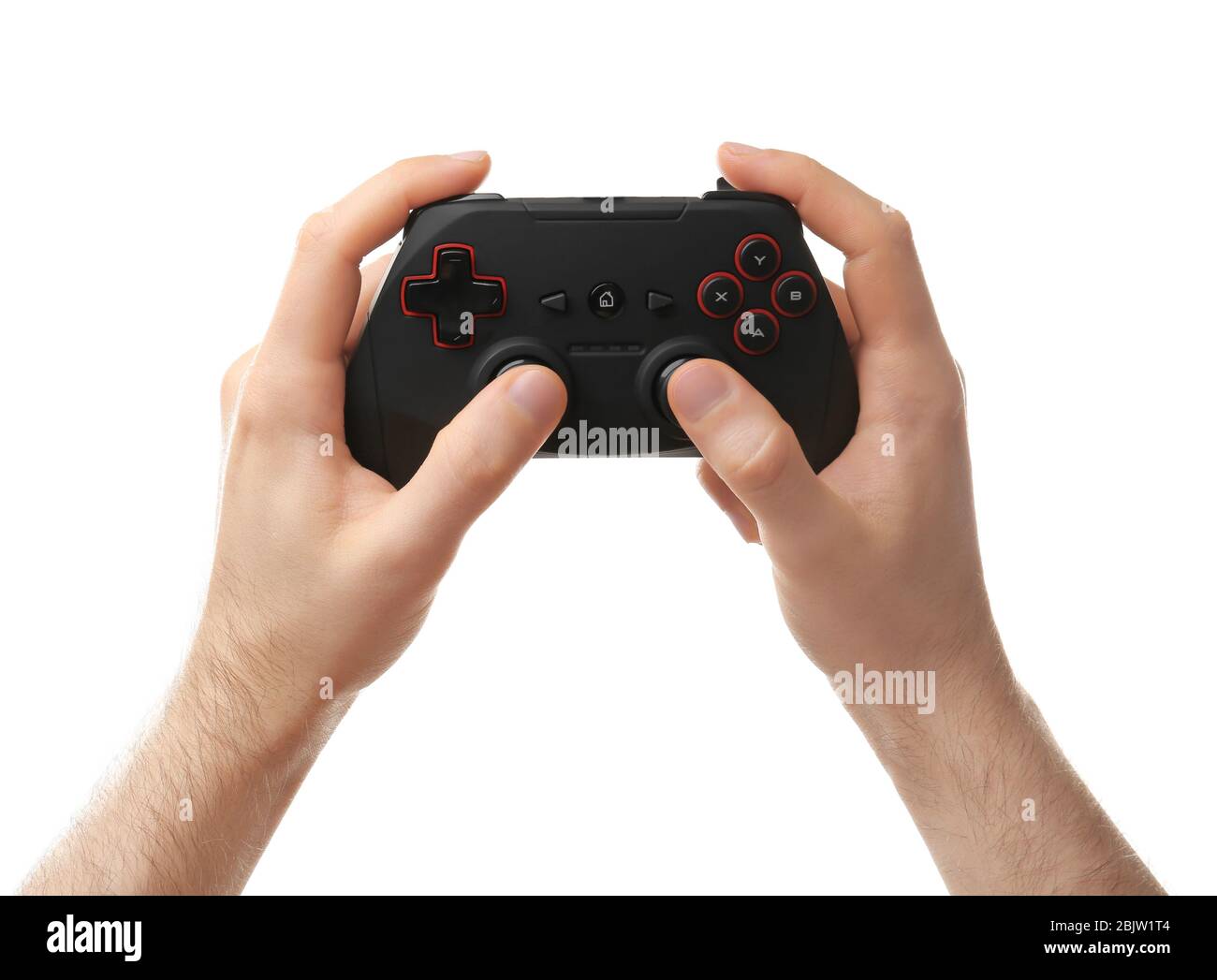 Man holding video game controller on white background Stock Photo - Alamy
