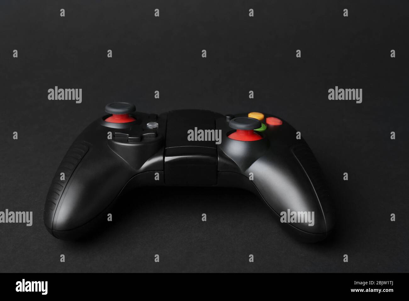Video game controller on dark background Stock Photo - Alamy