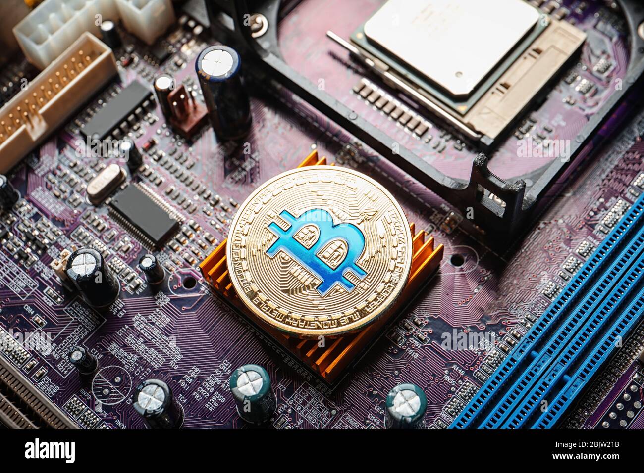 Golden bitcoin on PC motherboard Stock Photo - Alamy