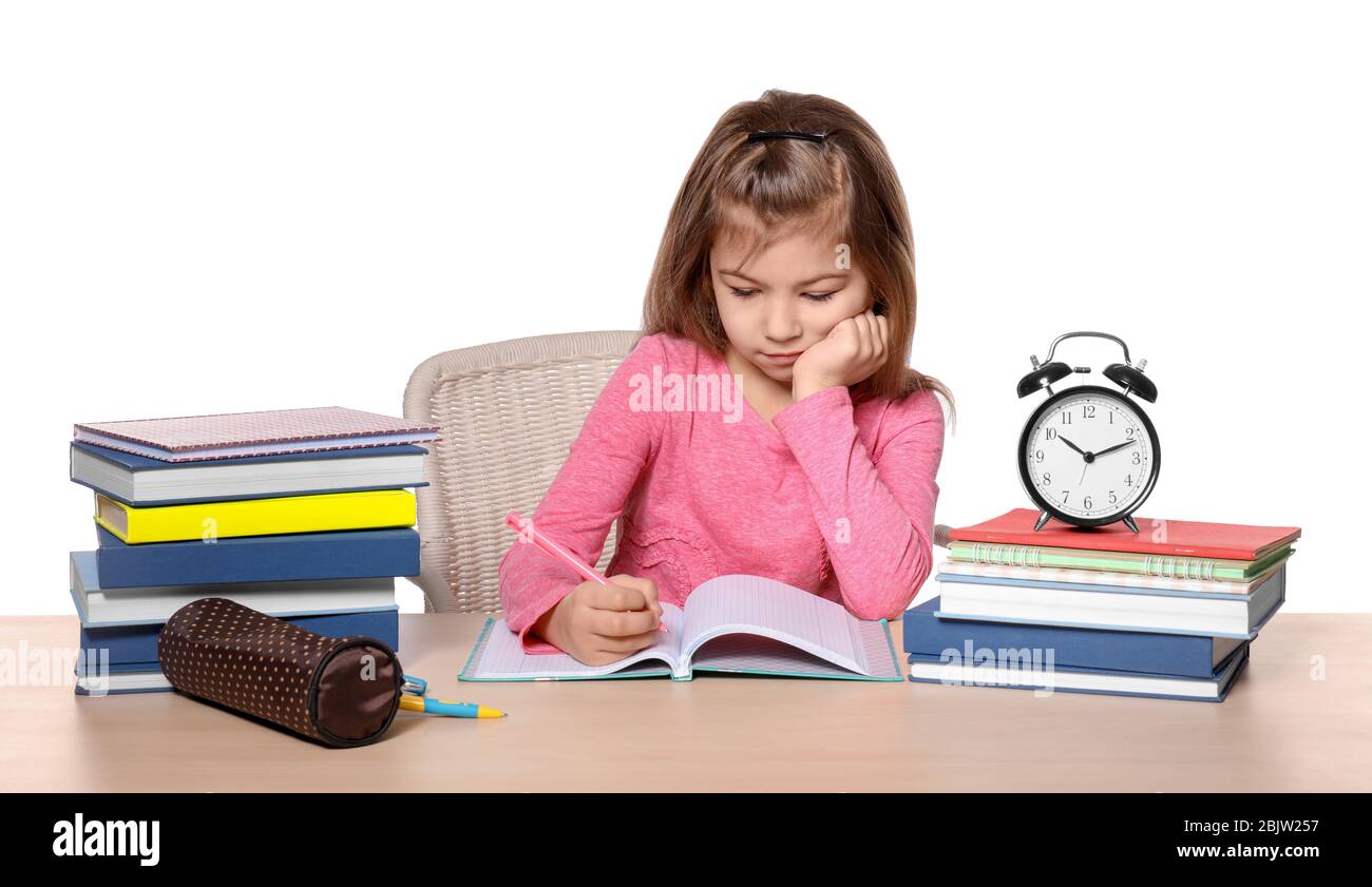 Cute little girl doing homework against white background Stock Photo ...