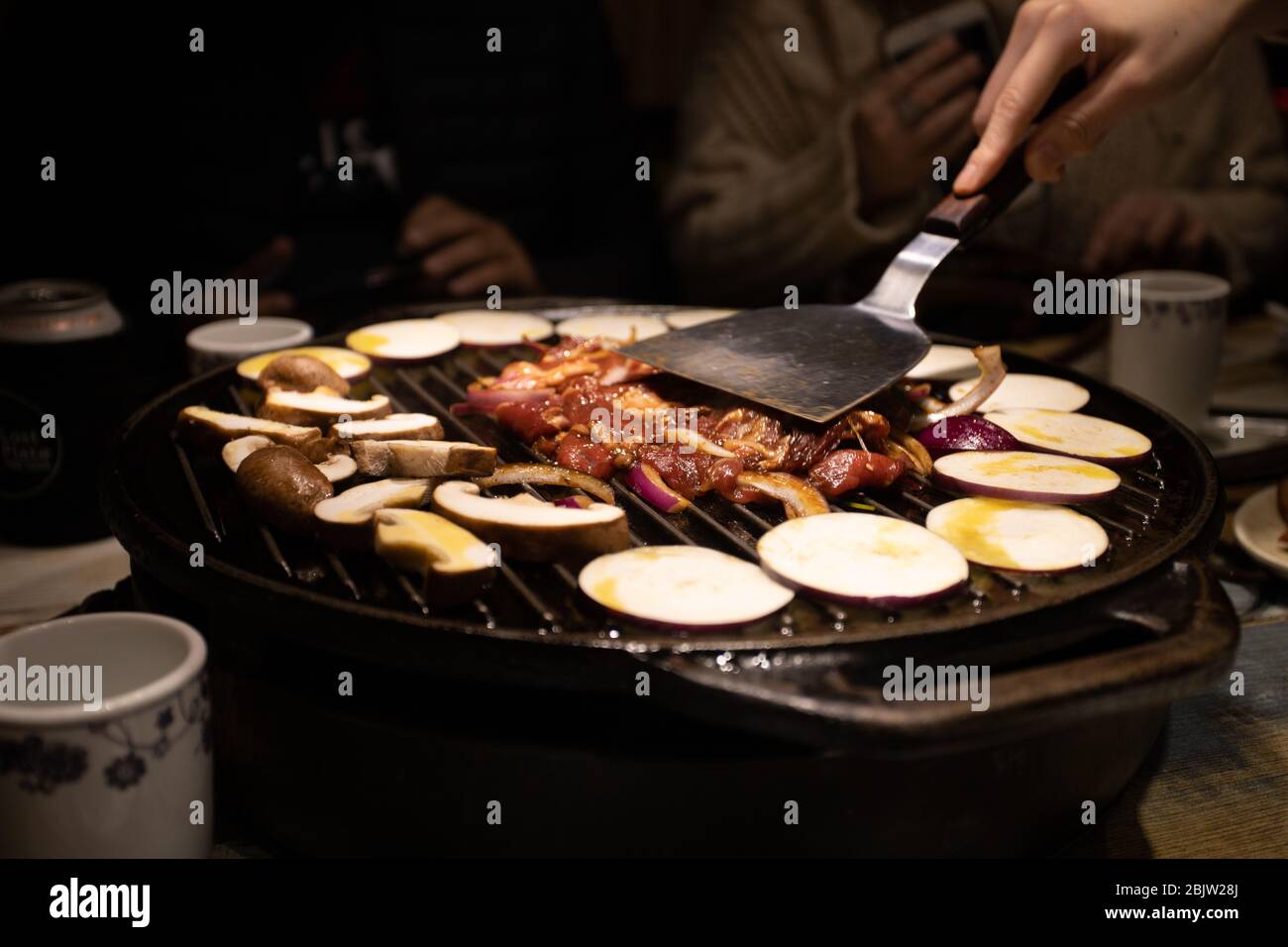 Street food cooking on griddle in Beijing China Stock Photo - Alamy