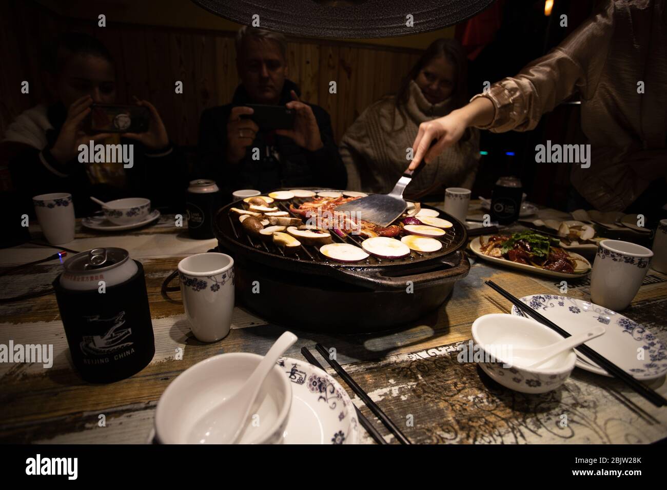 Street food cooking on griddle in Beijing China Stock Photo - Alamy