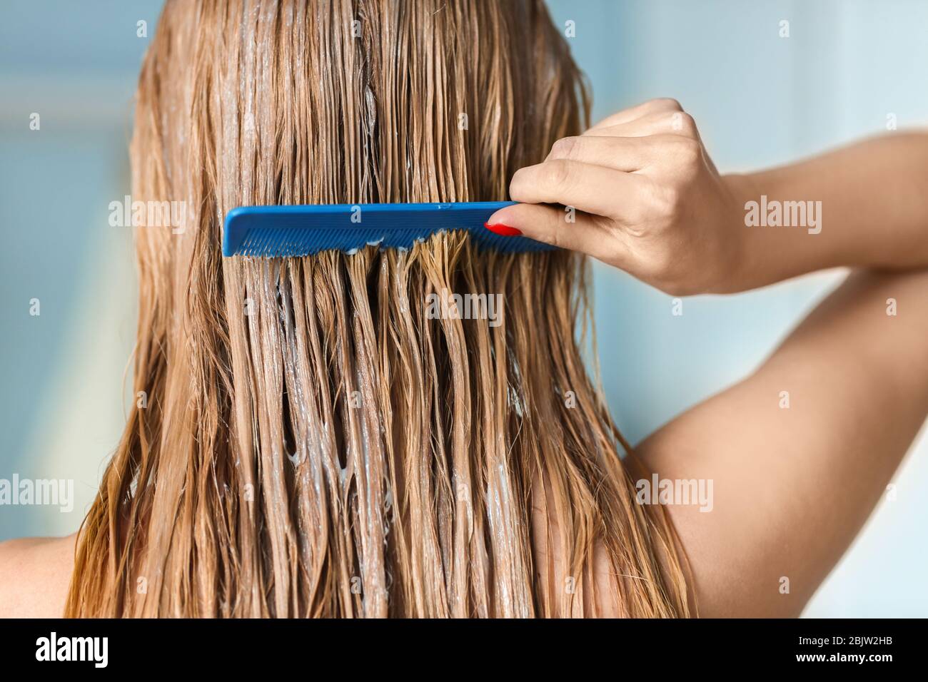 Hair cream woman combing hi-res stock photography and images - Alamy
