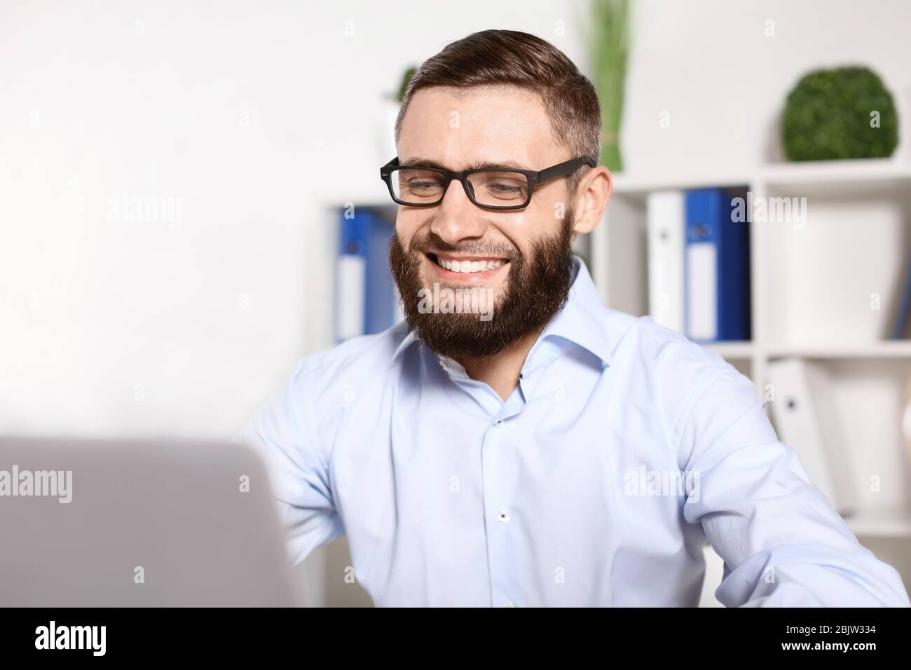 Portrait of handsome bearded man indoors Stock Photo - Alamy