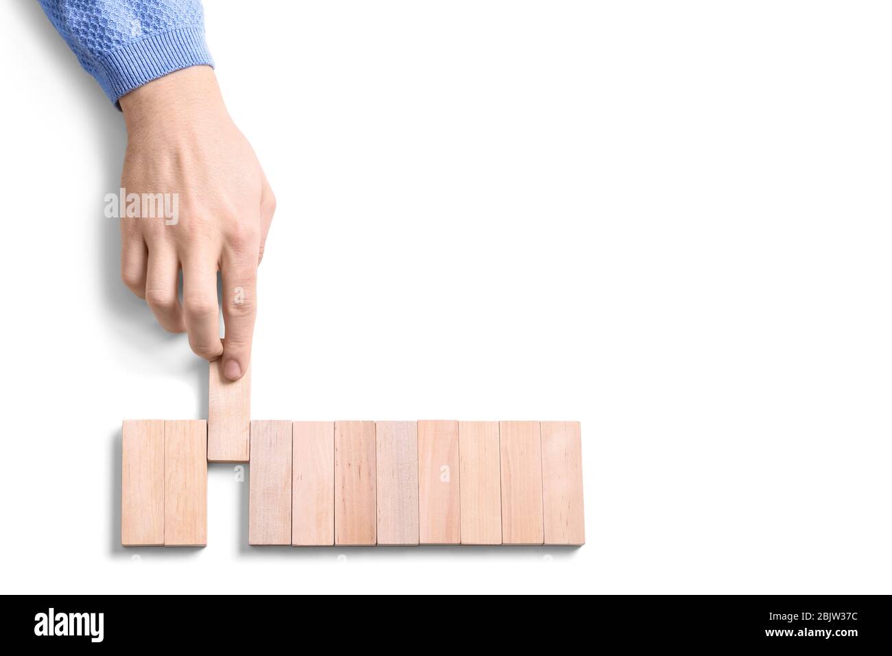 Man with wooden blocks on white background. Unity concept Stock Photo ...