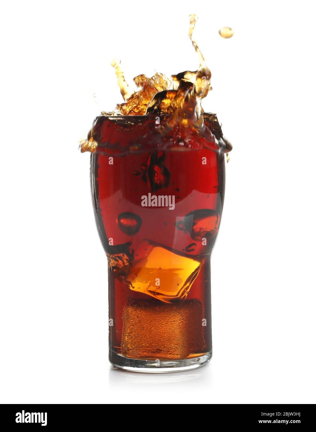 Splash of cola in glass on white background Stock Photo - Alamy