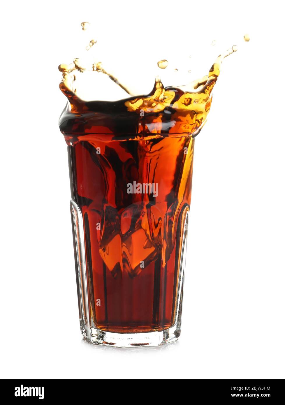 Splash of cola in glass on white background Stock Photo - Alamy