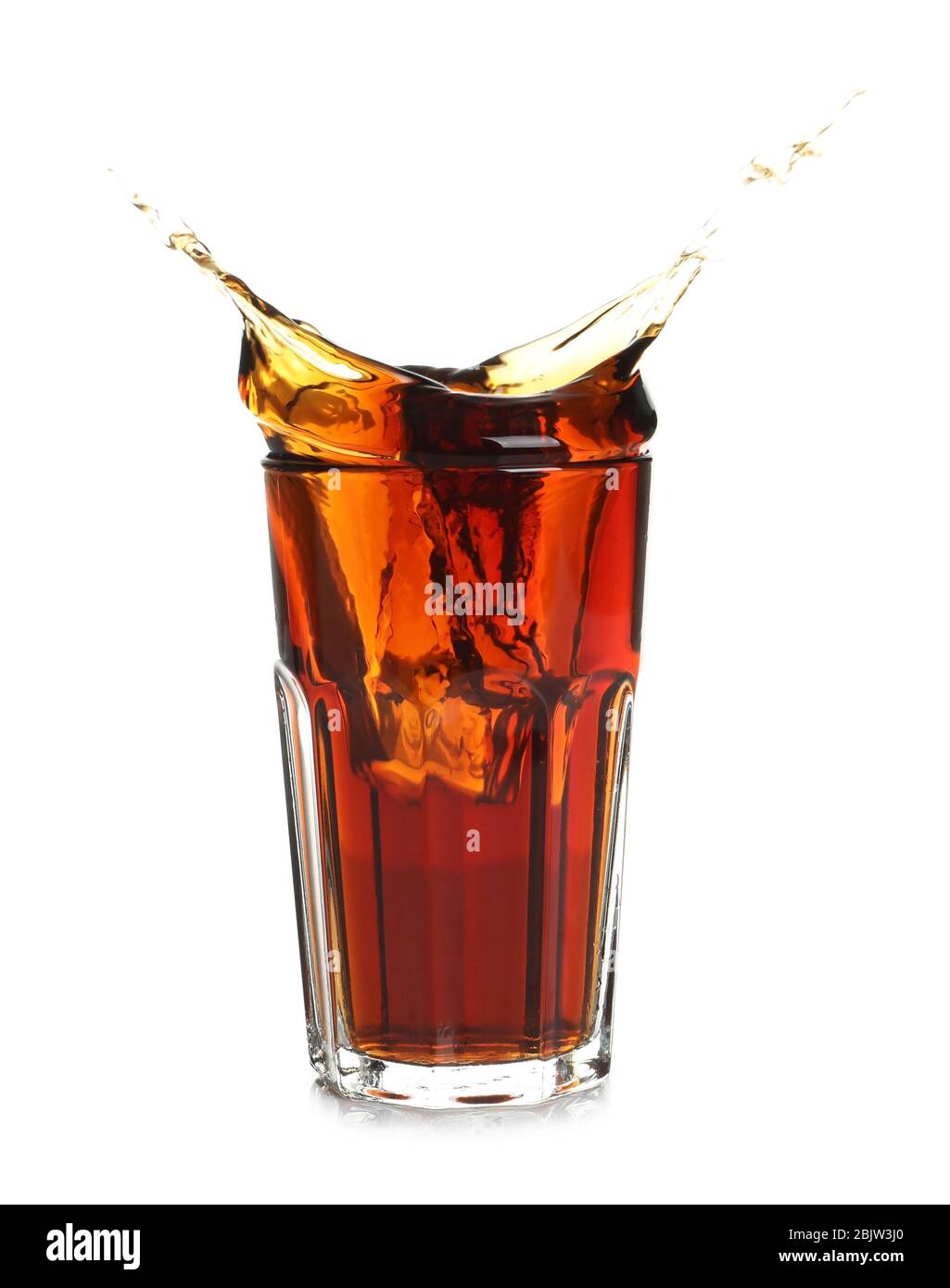 Splash of cola in glass on white background Stock Photo - Alamy