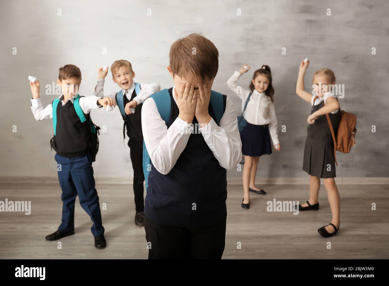 Children bullying their classmate indoors Stock Photo - Alamy