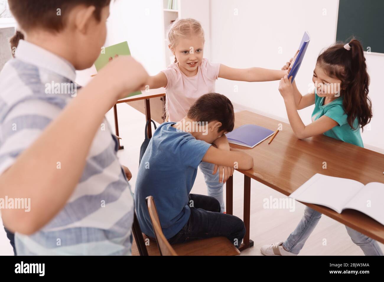 Little girl protecting her classmate from bullying in school Stock ...