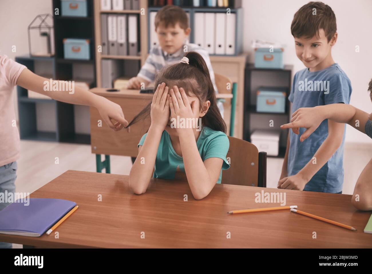 Children bullying their classmate in school Stock Photo - Alamy