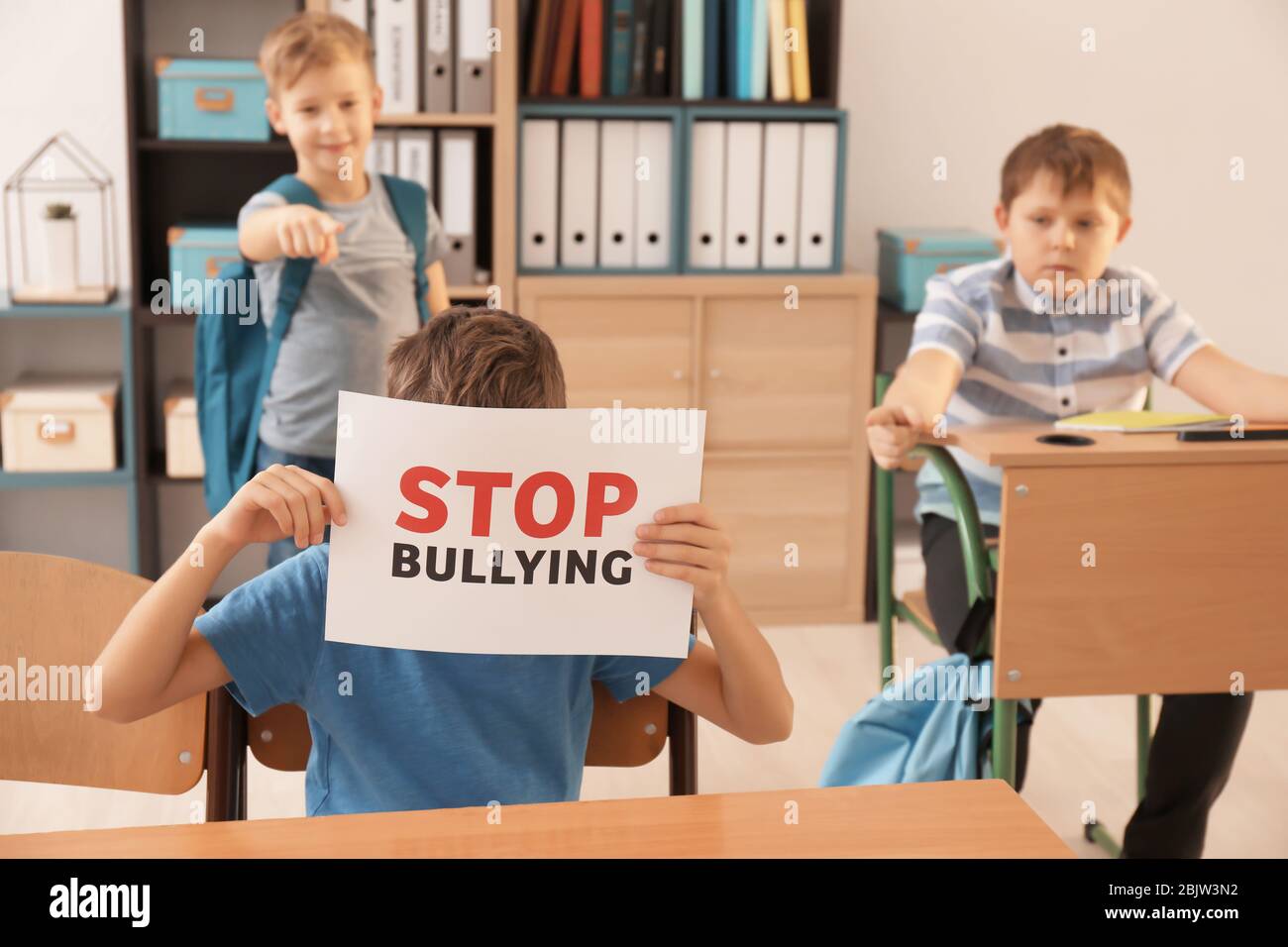 Children in classroom behind hi-res stock photography and images - Alamy