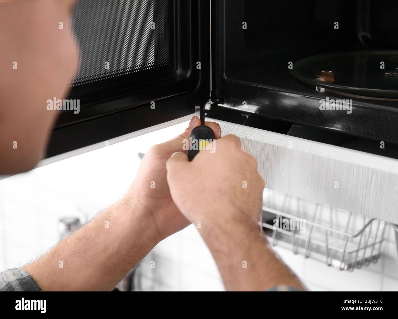 Microwave oven man hi-res stock photography and images - Alamy