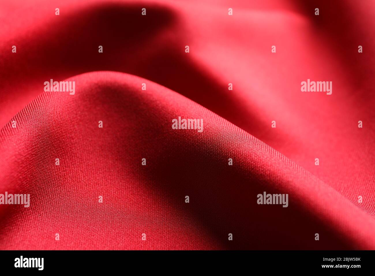Fabric texture with folds as background Stock Photo - Alamy