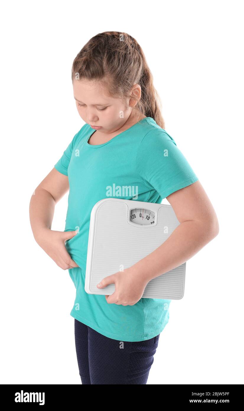 Overweight girl with floor scales on white background Stock Photo - Alamy