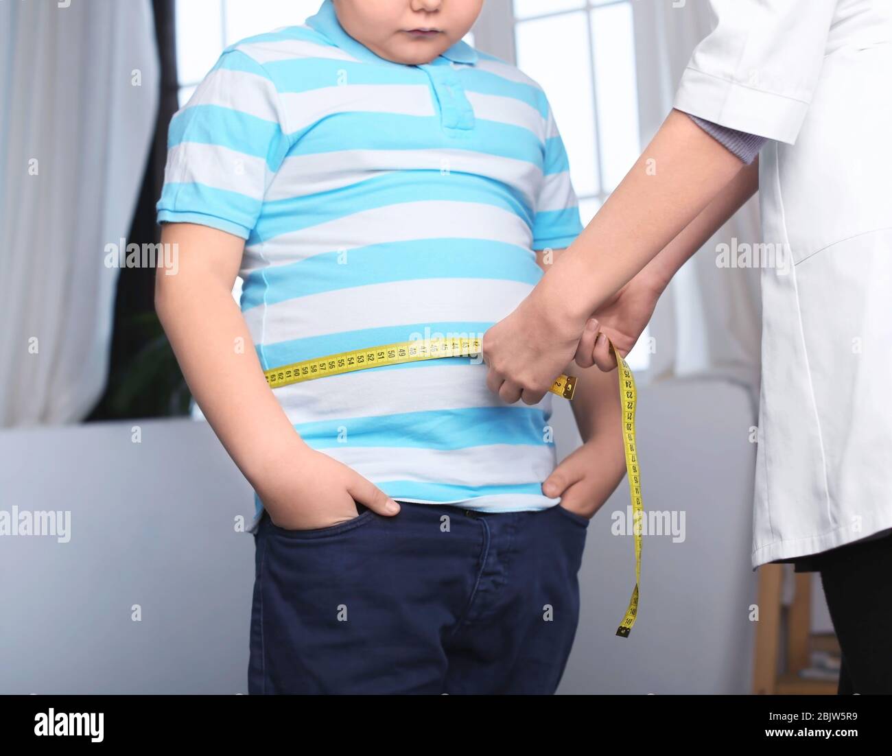 Overweight boy doctor hi-res stock photography and images - Alamy